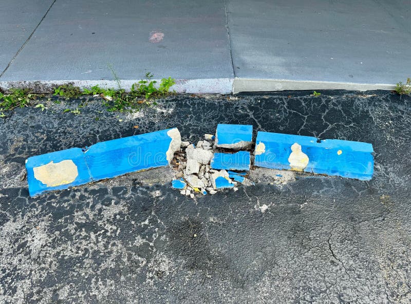 Blue Brick Shattered on a Concrete Surface, Fragments Lying Scattered ...