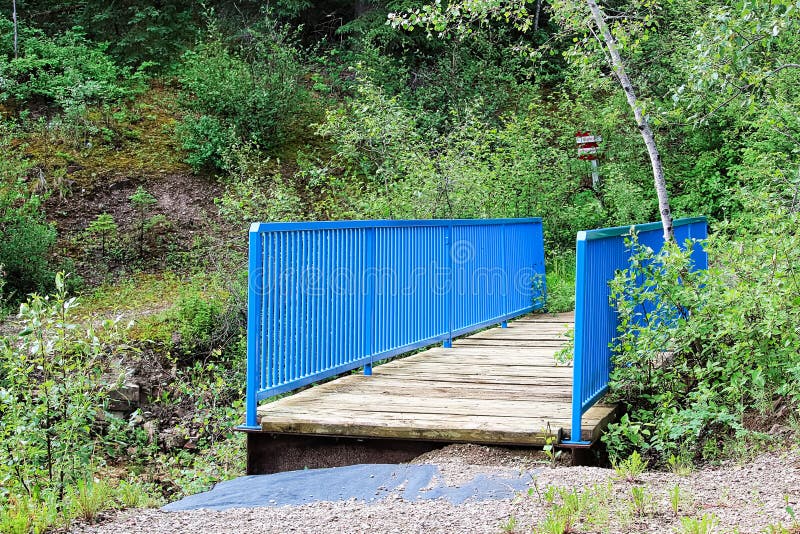 A Blue Bridge on a Hiking Trail Stock Image - Image of guide, road ...