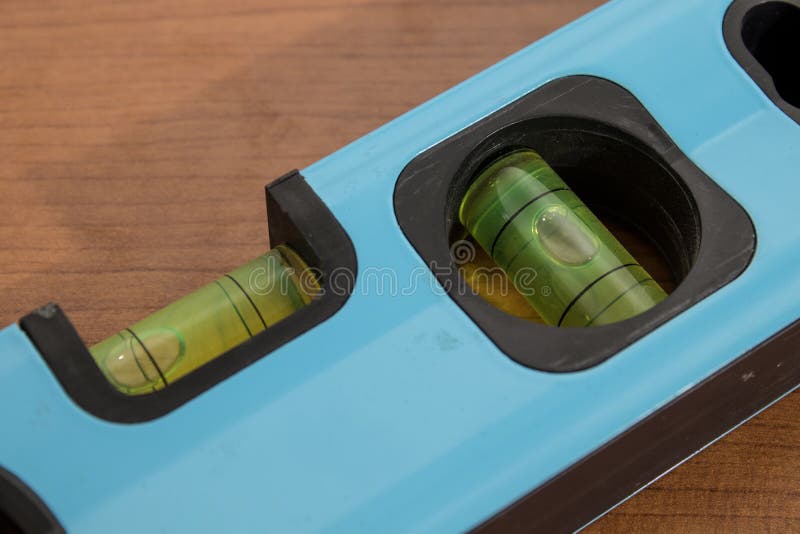 Blue Bubble Level on a Wood Table Stock Photo - Image of spirit ...
