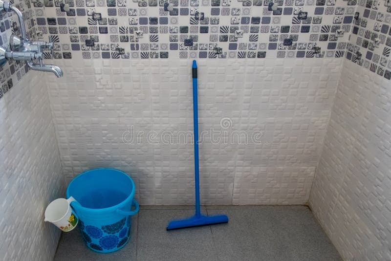 Blue Bucket with Mug and Wiper in Bathroom Stock Image - Image of ...