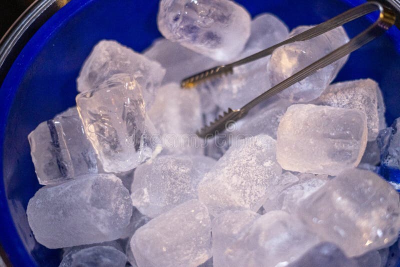 Blue Bucket with Various Ice Cubes and Tongs Stock Photo - Image of ...