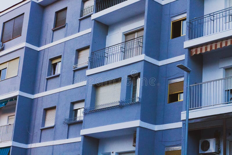 Blue building street stock photo. Image of hotel, hanging - 196355474