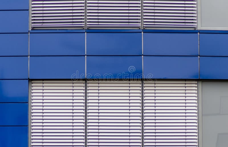 Blue Building Facade with Windows and Louvers Stock Image - Image of ...