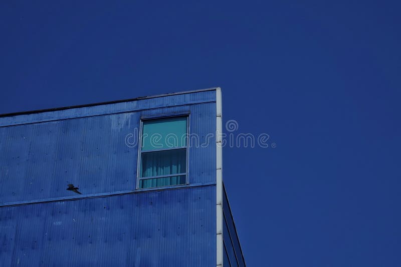 Blue Building and Window on a Blue Sky Background Stock Photo - Image ...