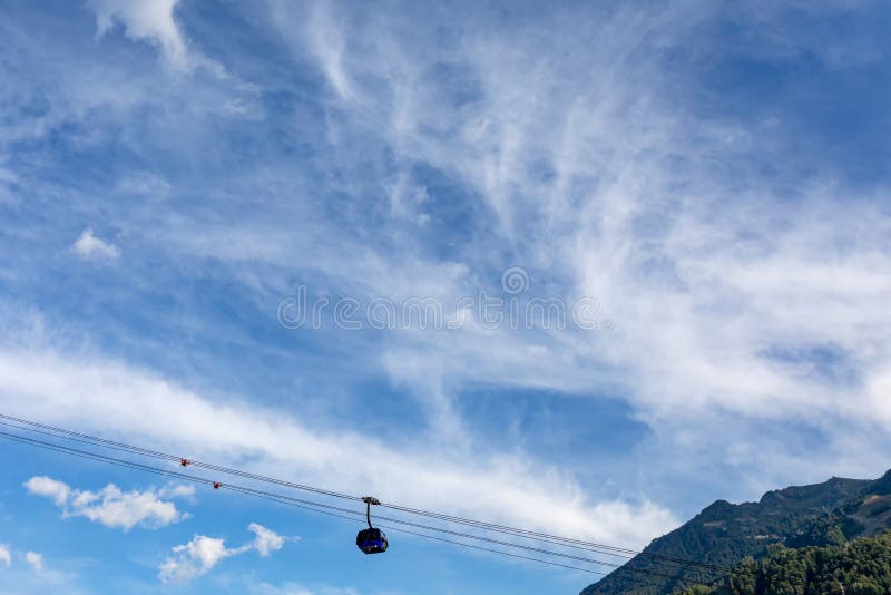 Blue Cable Car Above the Clouds Against the Sky Stock Photo - Image of ...