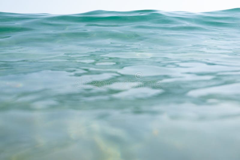 Blue Calm Sea with Waves and Rays of Sunlight Shining through, on the ...