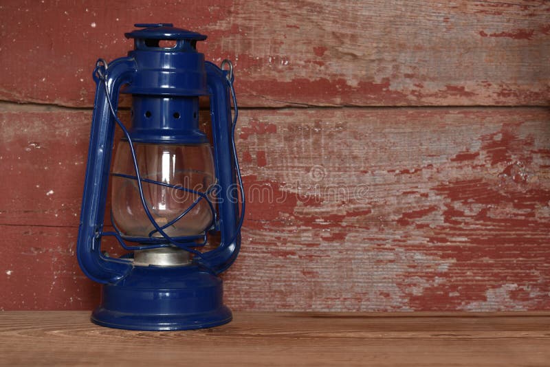 A Blue Camping Lantern on Red Barn Board Stock Photo - Image of barn ...