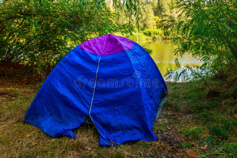 Blue Camping Tent in Forest Near a River Stock Photo - Image of hiking ...