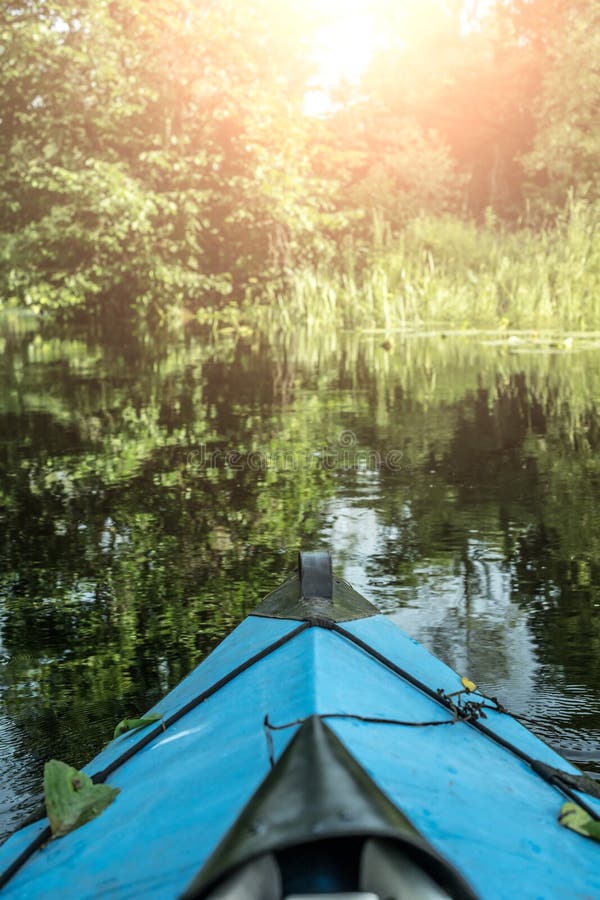 Blue canoe on the river stock photo. Image of lifestyle - 109826802