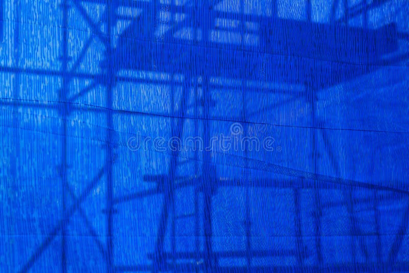 Blue Canvas Covering the Building Under Construction Facade Stock Photo ...