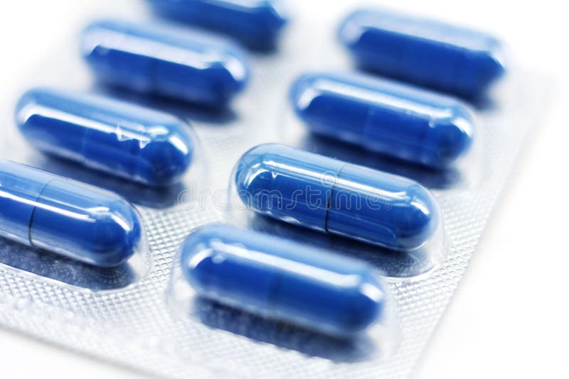 Two Blue Capsules. Pills for Men`s Health and Sexual Energy on an ...