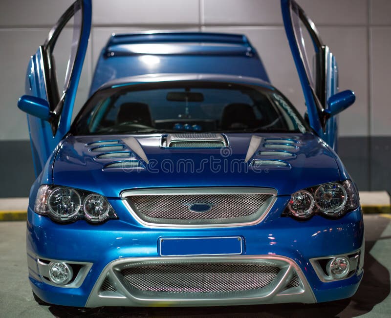 Blue car with angel wings stock image. Image of door - 34843807