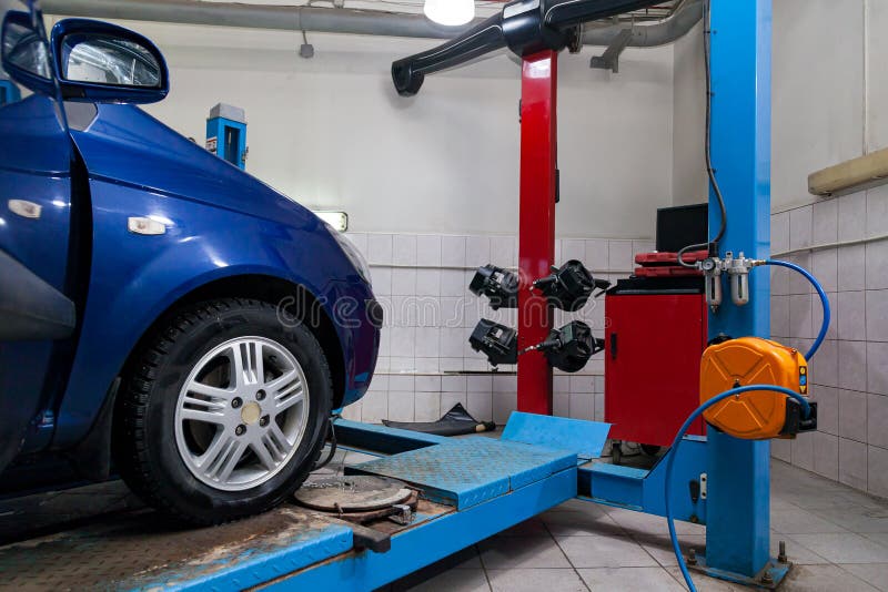 Blue Car Front Wheel View Stands on the Stand Wheel Alignment ...