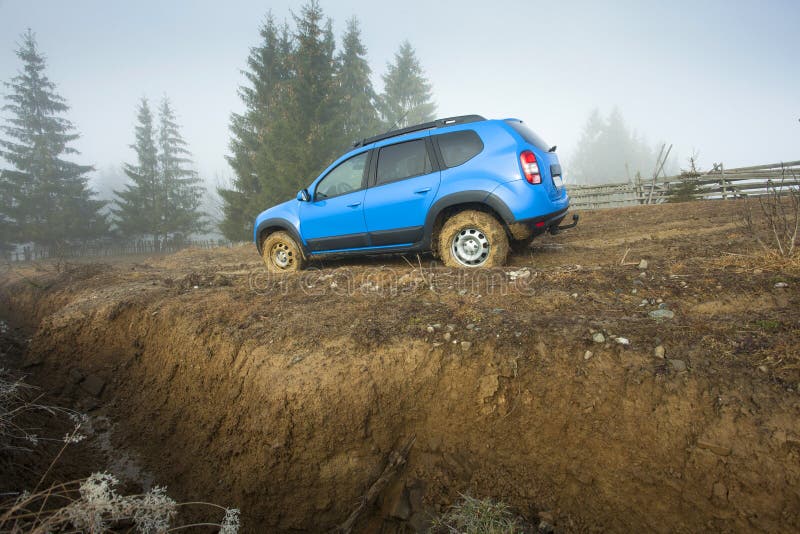 Blue car with mud stock image. Image of terrain, travel - 218870407