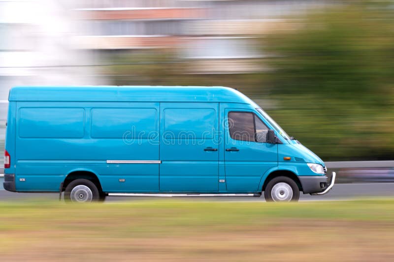 Blue Cargo Van in Motion on Street Stock Image - Image of rush, light ...