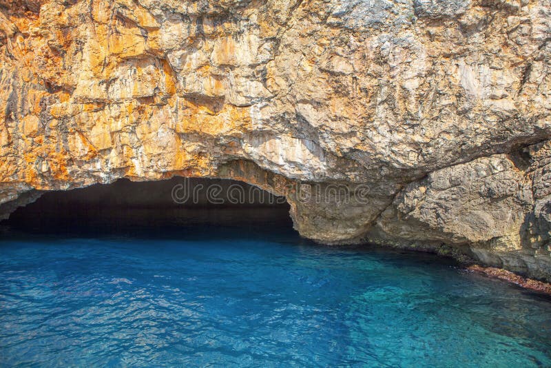 Cave with blue water stock image. Image of transparent - 142685381