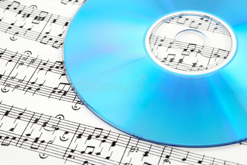 Audio CD and music notes stock image. Image of record - 4386417