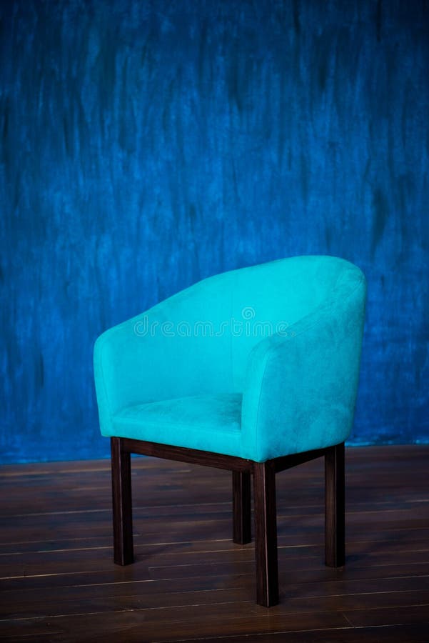 Blue Chair Against the Blue Wall. Interior Stock Image - Image of ...
