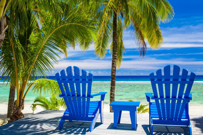 Blue Chairs on a Beach Front on Amazing Beach Stock Image - Image of ...
