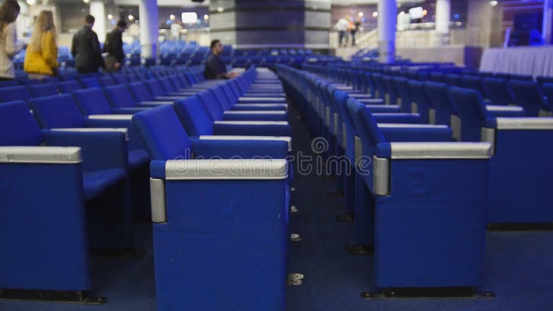 Blue Chairs in a Concert Hall, De-focused Stock Photo - Image of crowd ...