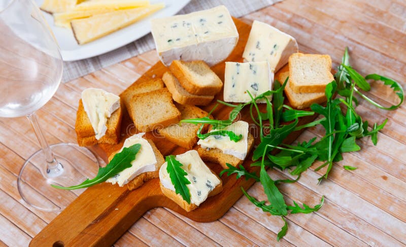 Blue Cheese Served with Toast and Arugula Stock Image - Image of ...