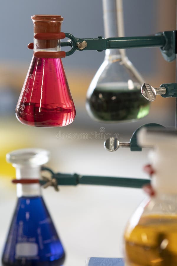 Blue Chemical Solutions and Glassware in a Science Laboratory Stock ...