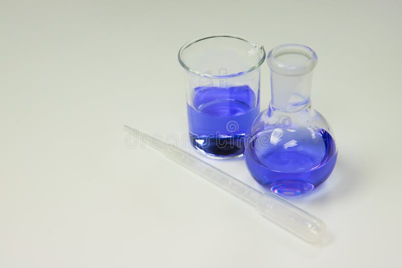 Blue Chemical Solutions and Glassware in a Science Laboratory Stock ...