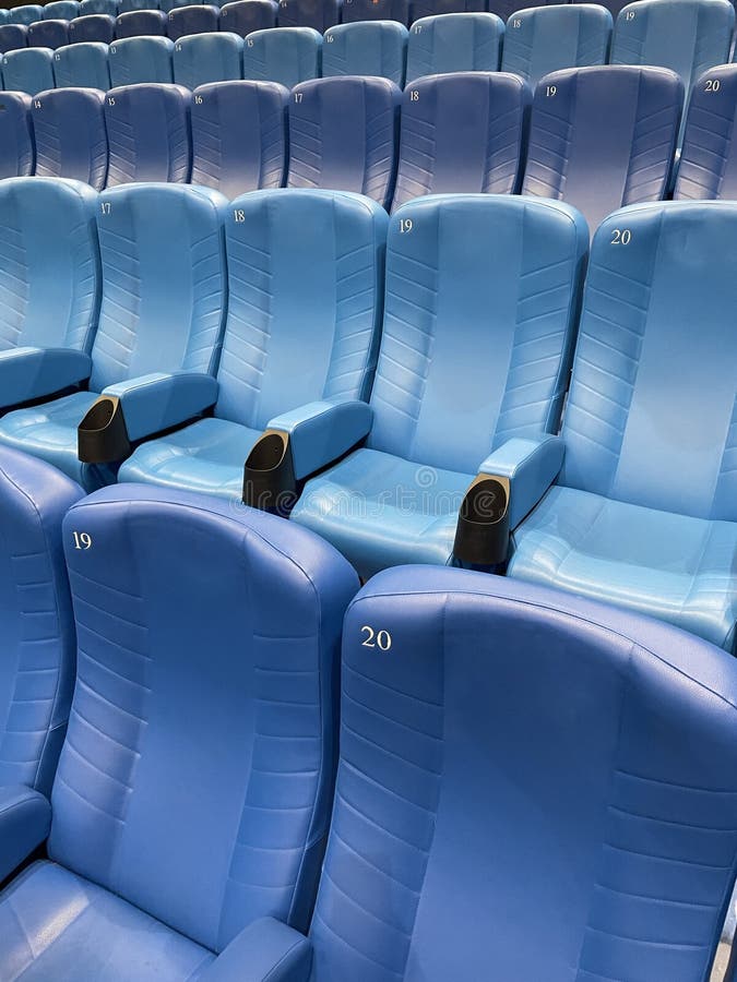 Blue cinema seats stock image. Image of table, arena - 333972003