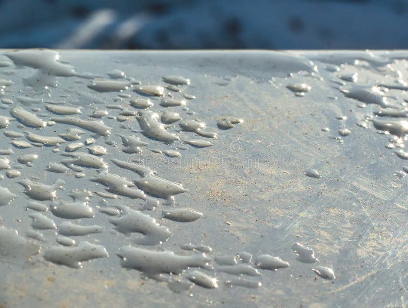 On a Blue Clad Tile Gleams a Drop of Water and Ice in the Sun_ Stock ...