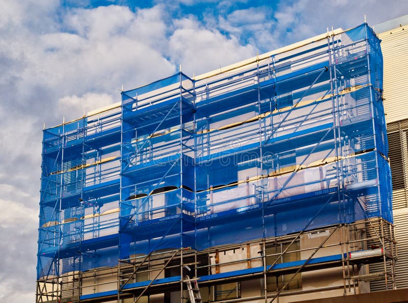 Scaffolding and Blue Safety Cladding on Construction Stock Photo ...