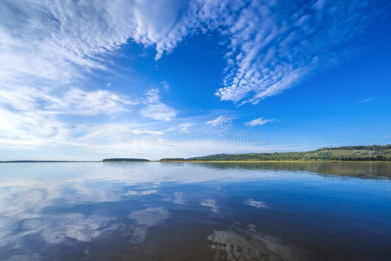 Blue clear lake stock image. Image of summer, clean, clouds - 65725373