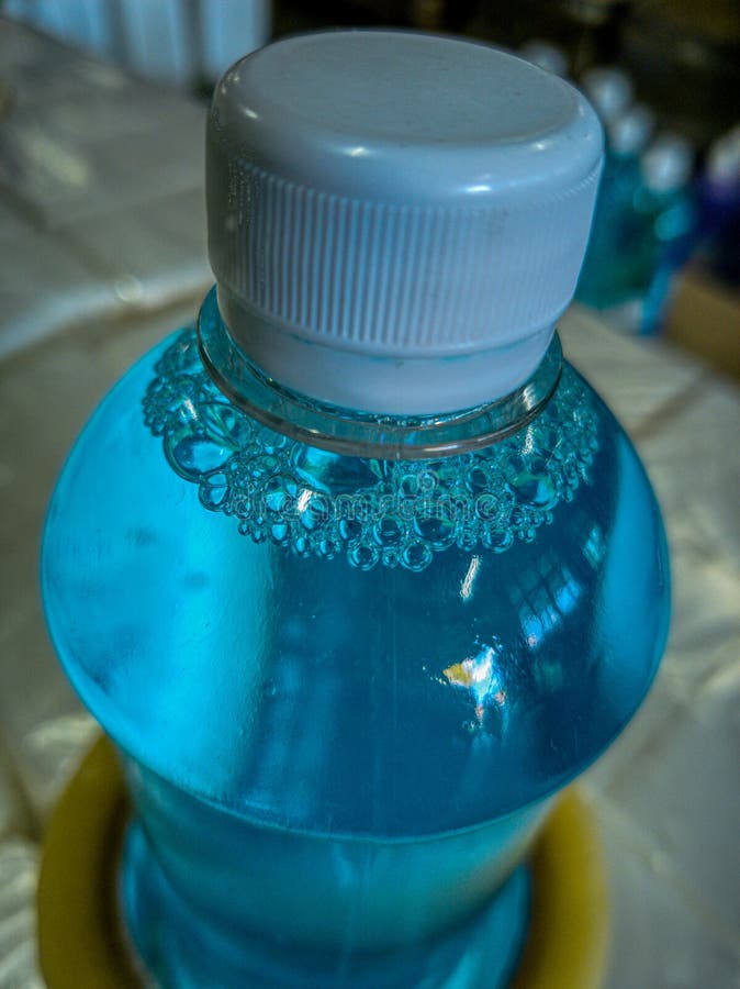 Blue-clear Liquid with Foam. Reflection on the Bottle Stock Photo ...
