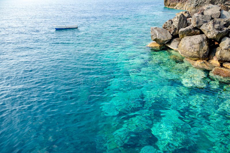 Blue Clear Water and Rocks of Island Santorini, Greece Stock Photo ...