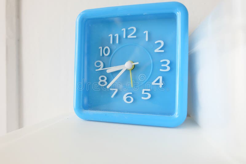 Blue clock in white stock image. Image of measurement - 90344775