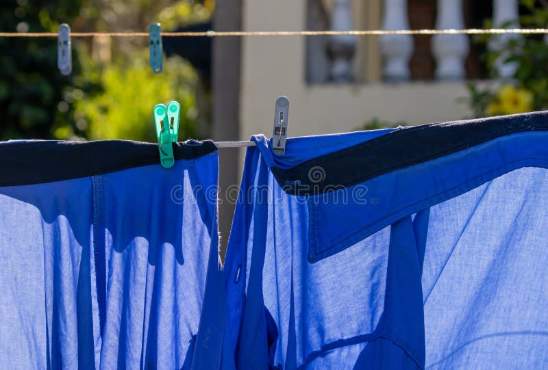 Clothes drying on a rope stock photo. Image of fashion - 203631386