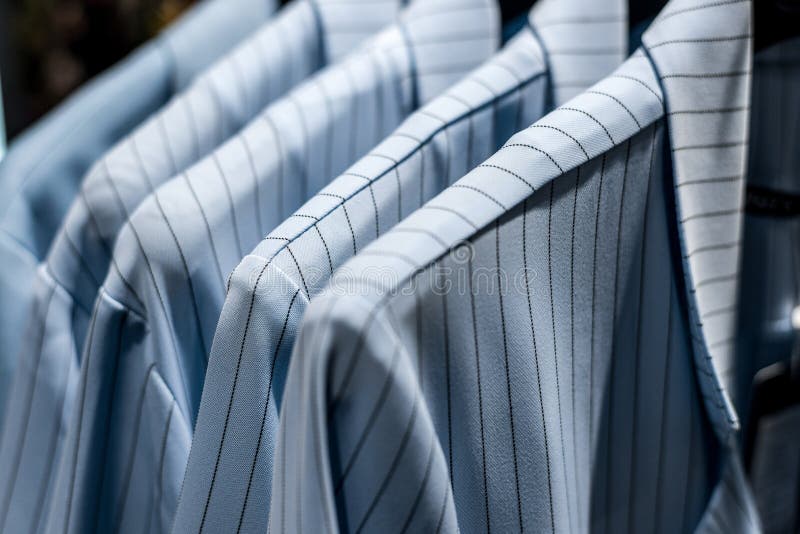 Blue Clothes Hanging on Store Racks Stock Photo - Image of blue ...