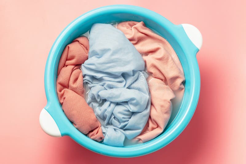 Blue Clothes Washed with Basin with Soap Bubbles, Top View Stock Photo ...