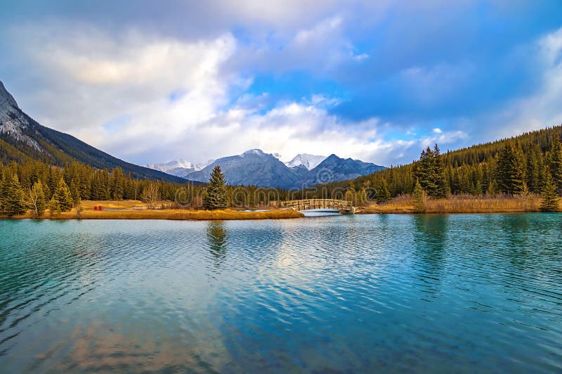Blue Cloudy Sky Over a Banff Park Stock Photo - Image of cascadeponds ...