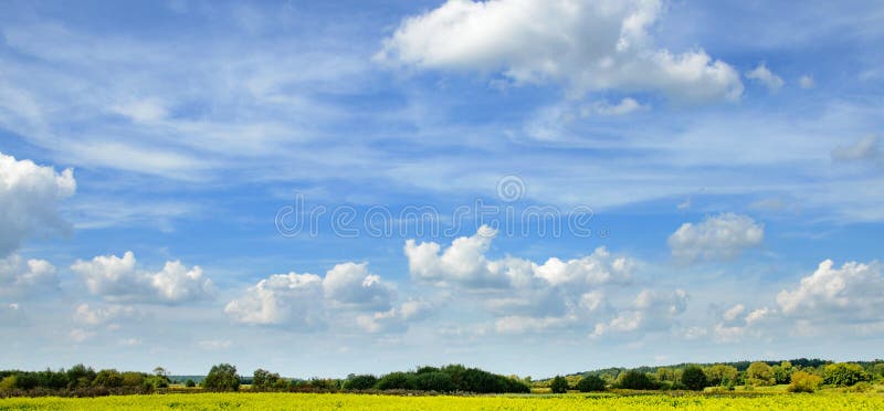 Blue cloudy sky over field stock photo. Image of blue - 158089764