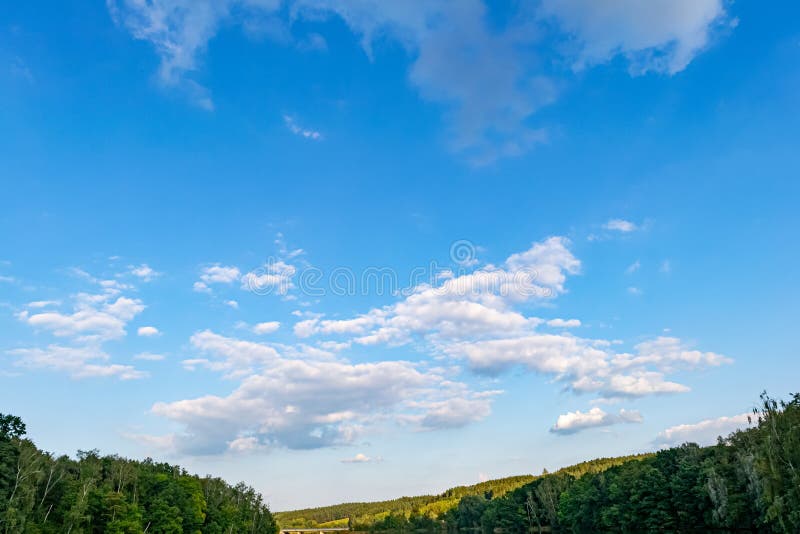 Blue Cloudy Sky Over a Forest Stock Photo - Image of outside, peaceful ...