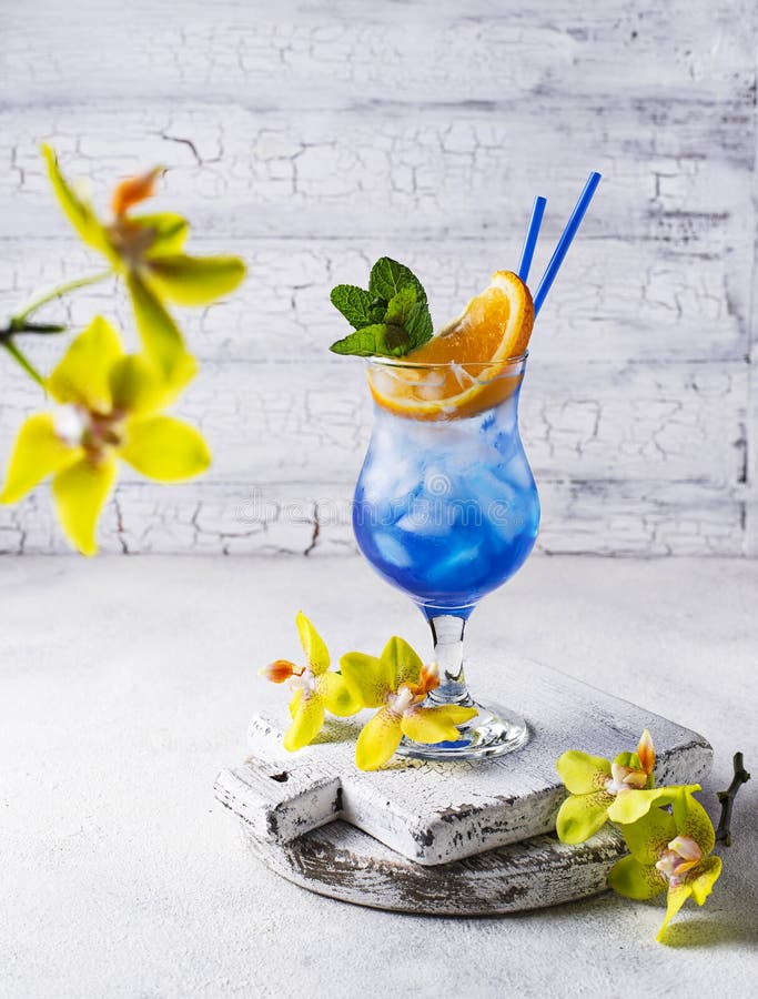 Blue Cocktail Drink with Ice and Orange Stock Photo - Image of ...