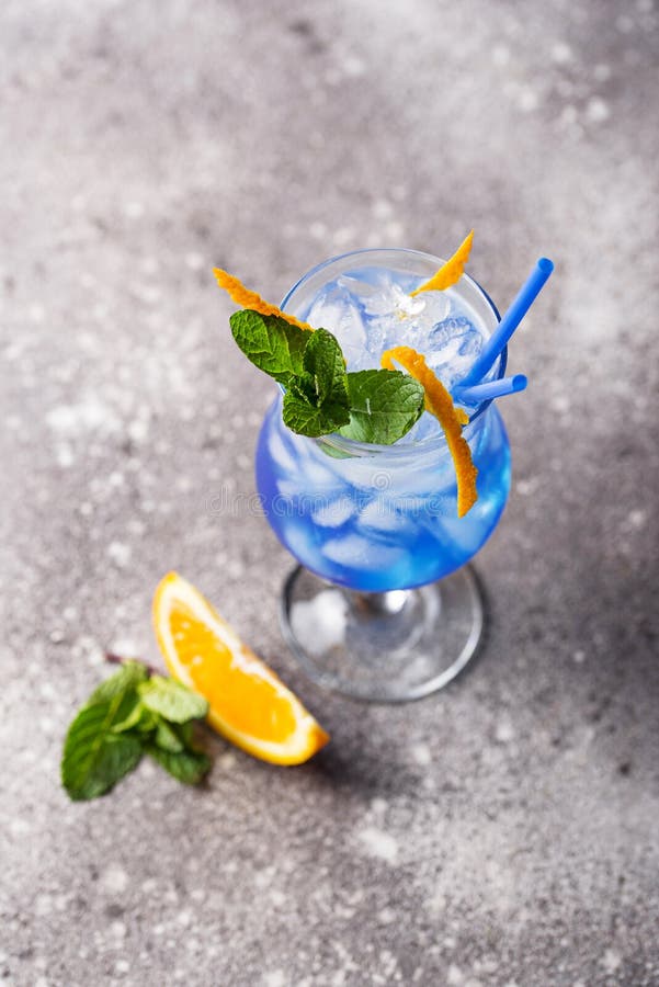 Blue Cocktail Drink with Ice and Orange Stock Image - Image of martini ...