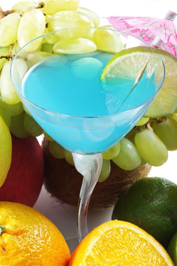 Blue cocktail among fruits stock image. Image of selective - 14354687