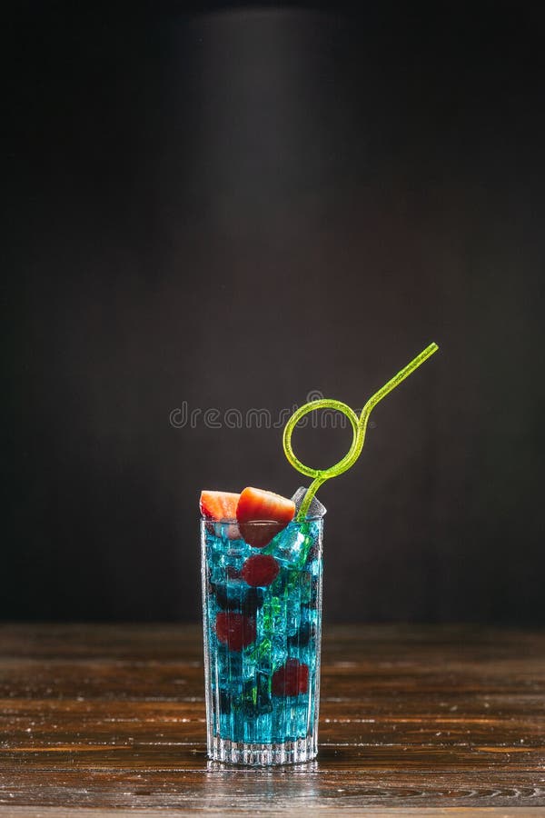 Blue Cocktail and Ice in a Glass Stock Image - Image of mixed, cube ...