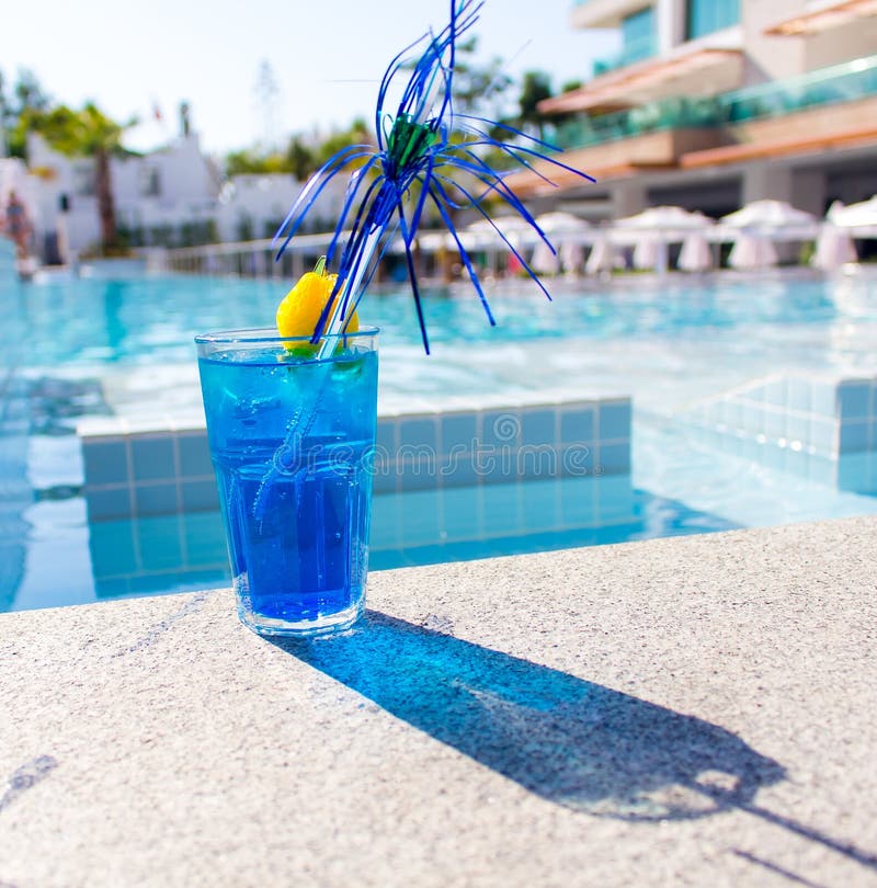 Blue Cocktail with Its Shadow and Poolside Stock Photo - Image of mixed ...