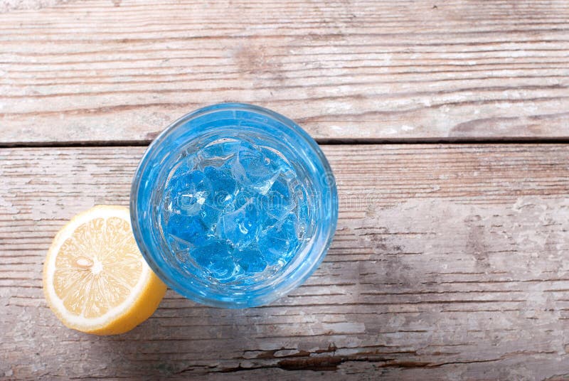 Blue Cocktail with Lemon and Ice Stock Image - Image of food, cube ...