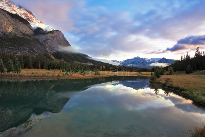 The Cold Lake, Forest and Snow Mountains in Canada Stock Image - Image ...