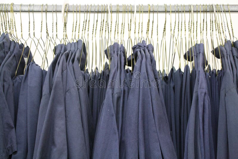 Blue Collar Work Shirts Uniforms on Hangers Stock Photo - Image of blue ...