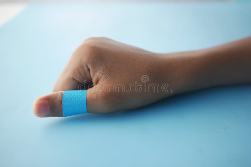 Blue Color Adhesive Bandage on Hand Stock Photo - Image of patch, black ...