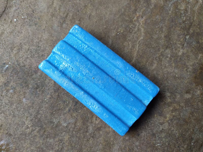 Blue Color Cloth Washing Soap with Isolated on Stone Background Stock ...